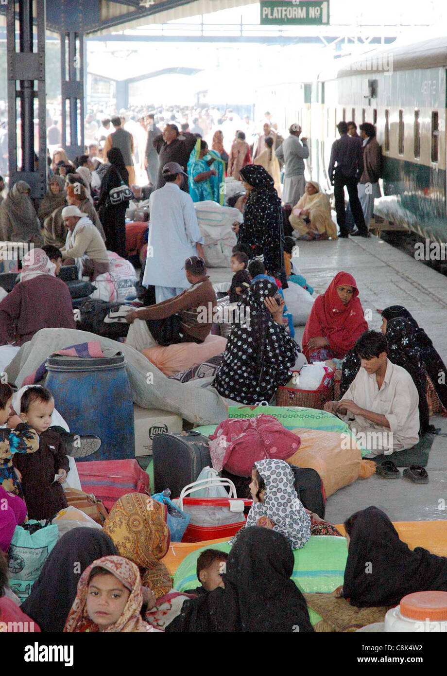 Passengers gather at platform while they are facing problems due to ...