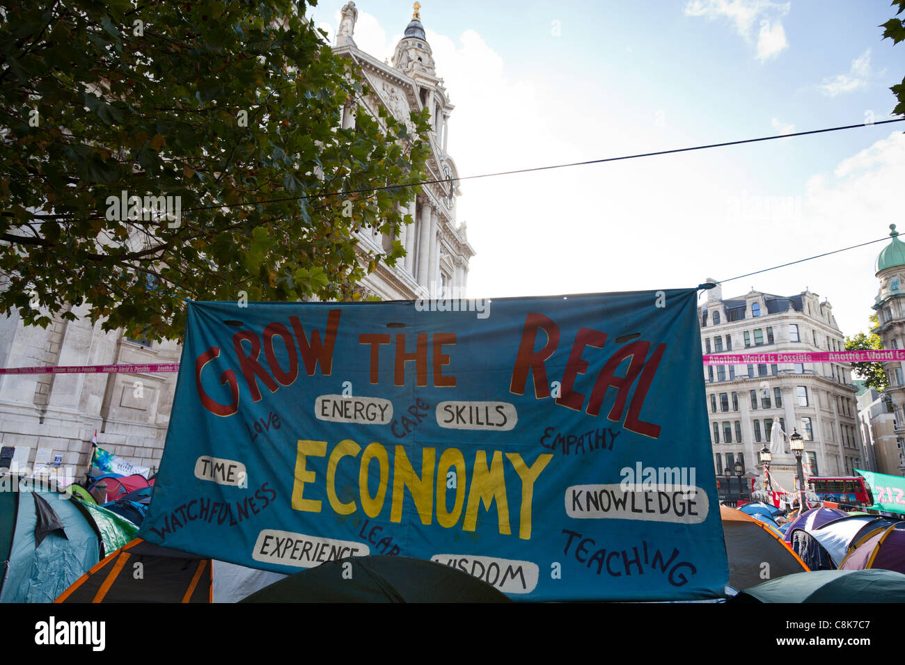 Anti-capitalist protest banners affixed to railings around St Paul's ...