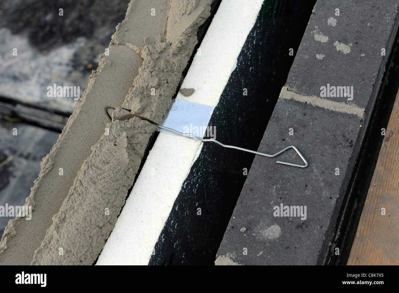 Cavity wall insulation and wall tie Stock Photo - Alamy