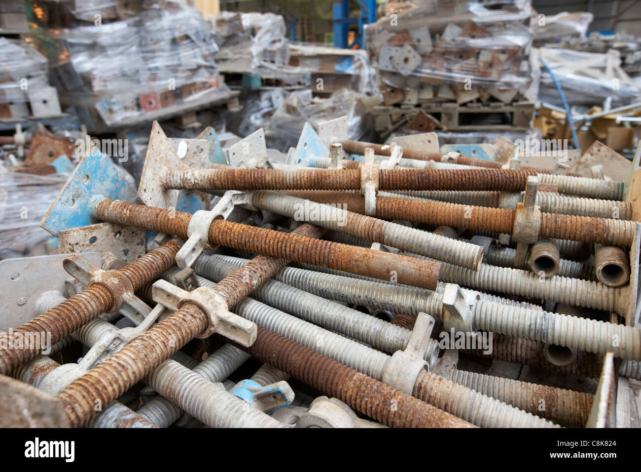 pile of used builders acro props in an old factory warehouse unit ...
