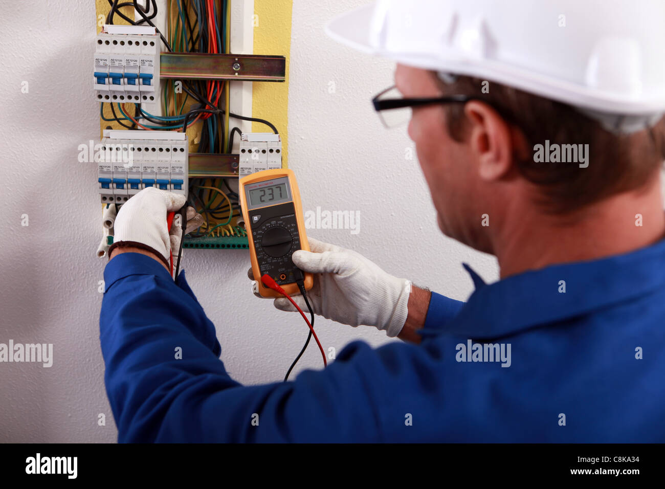An electrician checking the energy meter Stock Photo - Alamy
