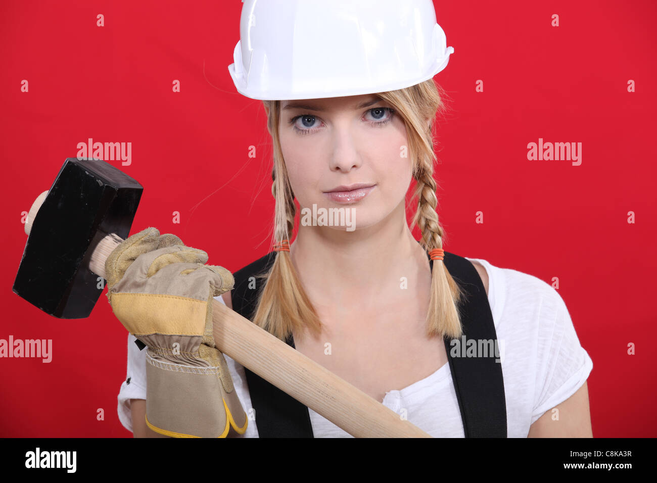 Girl holding mallet Stock Photo - Alamy