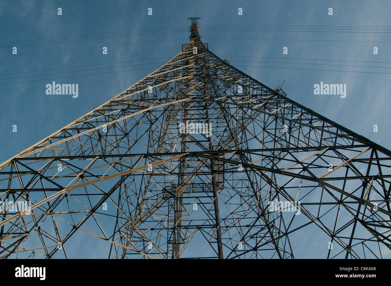 standing underneath and looking up at electrical pylon Stock Photo - Alamy