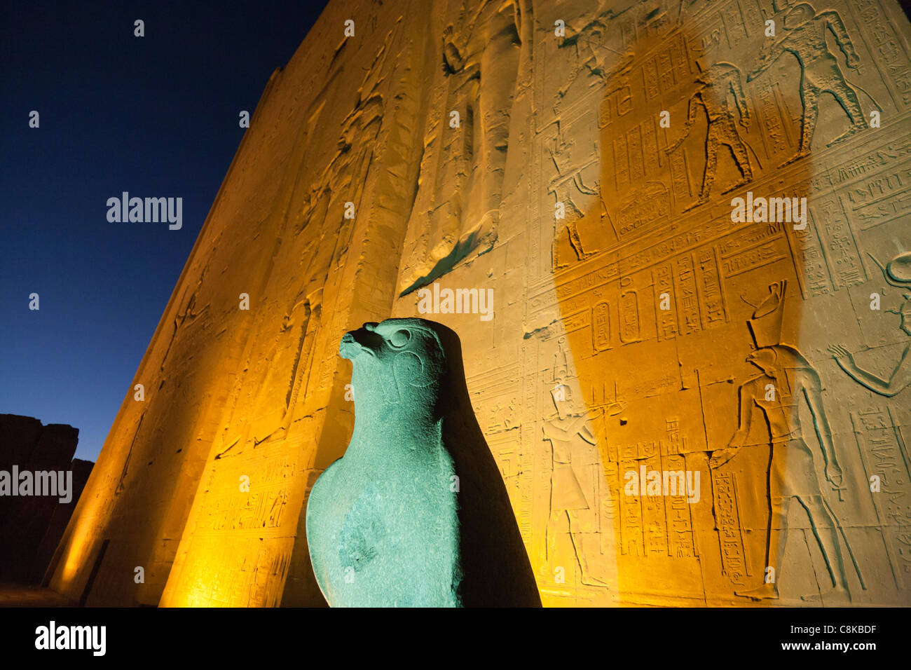 The statue of Horus of Behdet at sunset in the forecourt at the ...