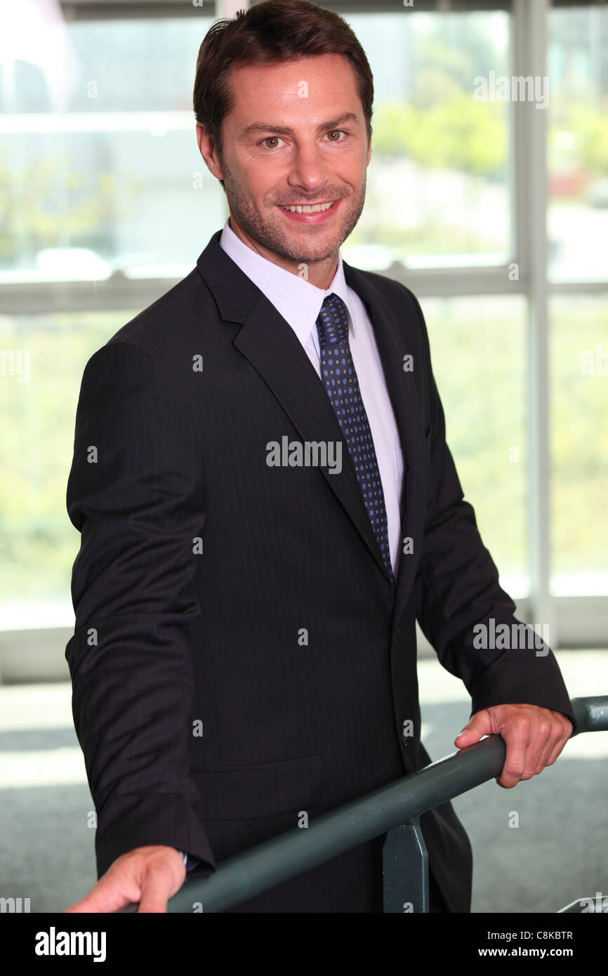Smart smiling male executive Stock Photo - Alamy