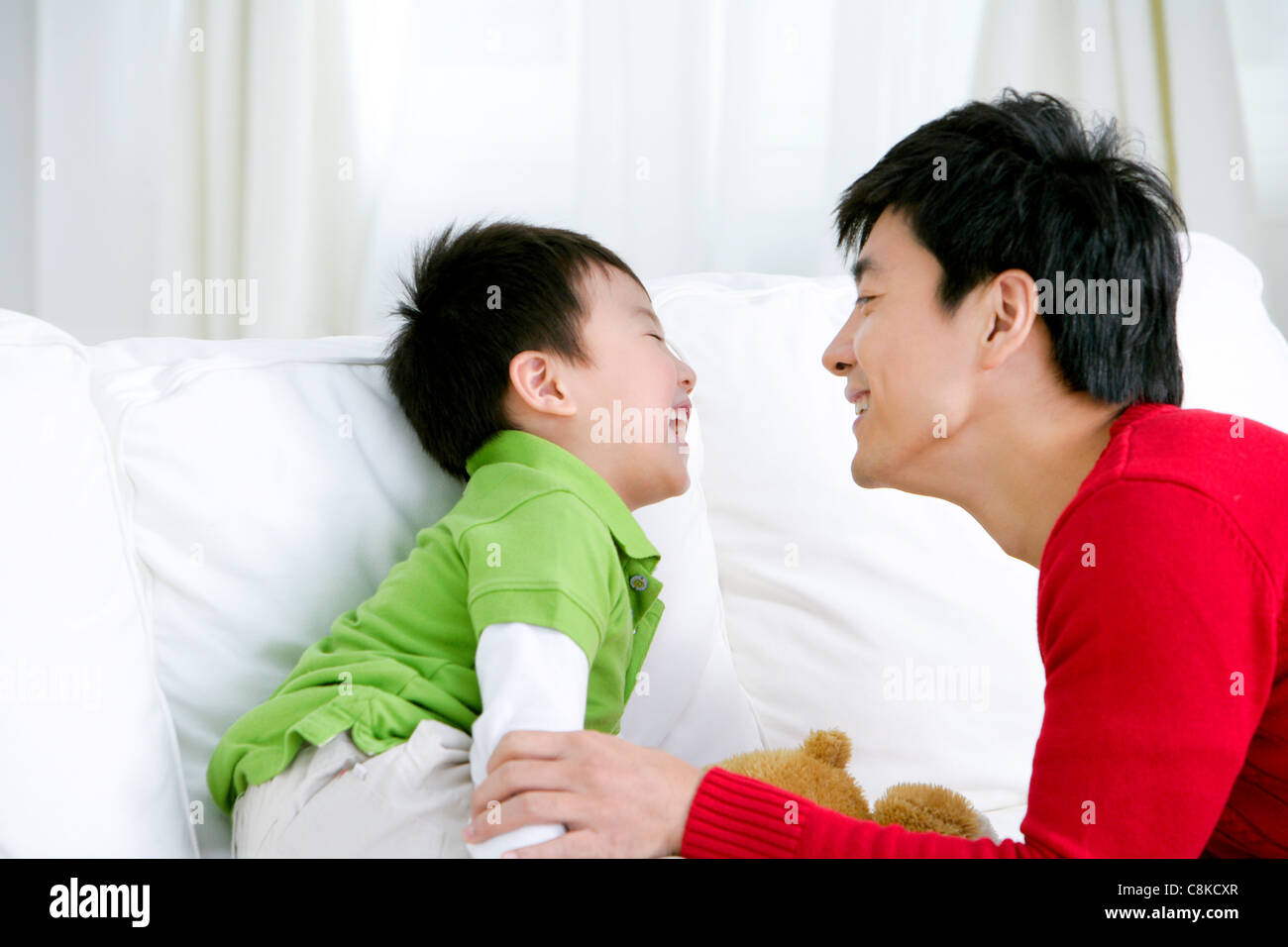 Happy Chinese father with son Stock Photo - Alamy