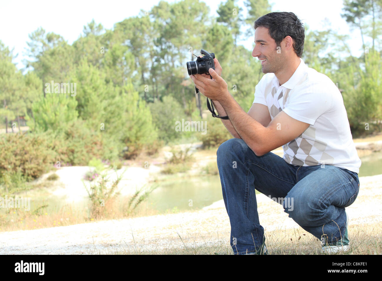 Man taking photo Stock Photo - Alamy