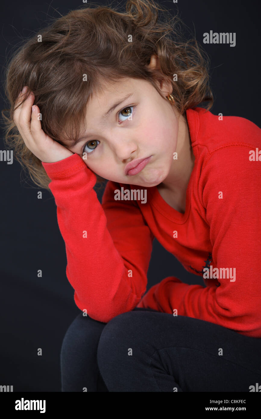 Little girl sulking Stock Photo - Alamy