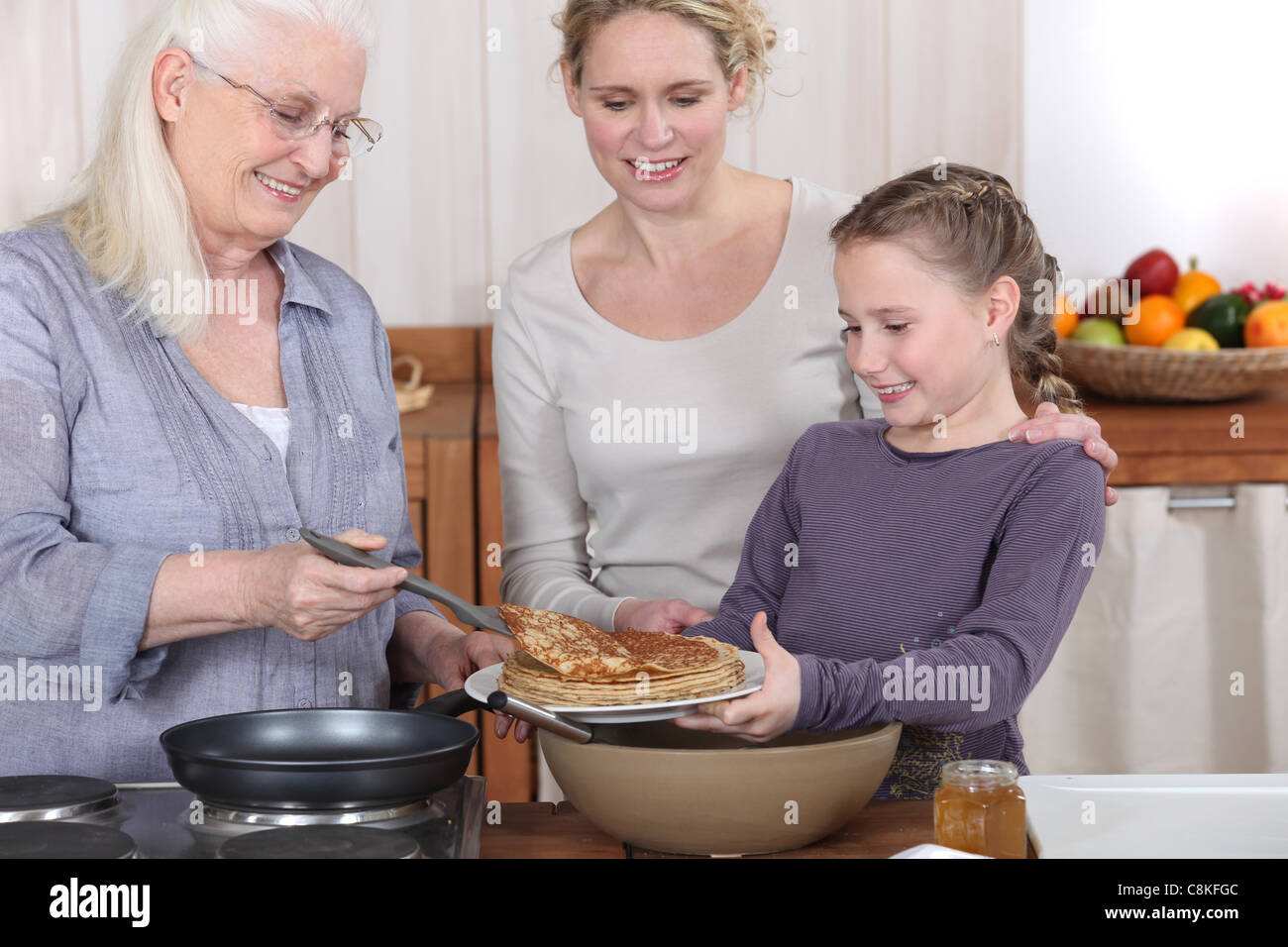 Family eating pancakes Stock Photo - Alamy