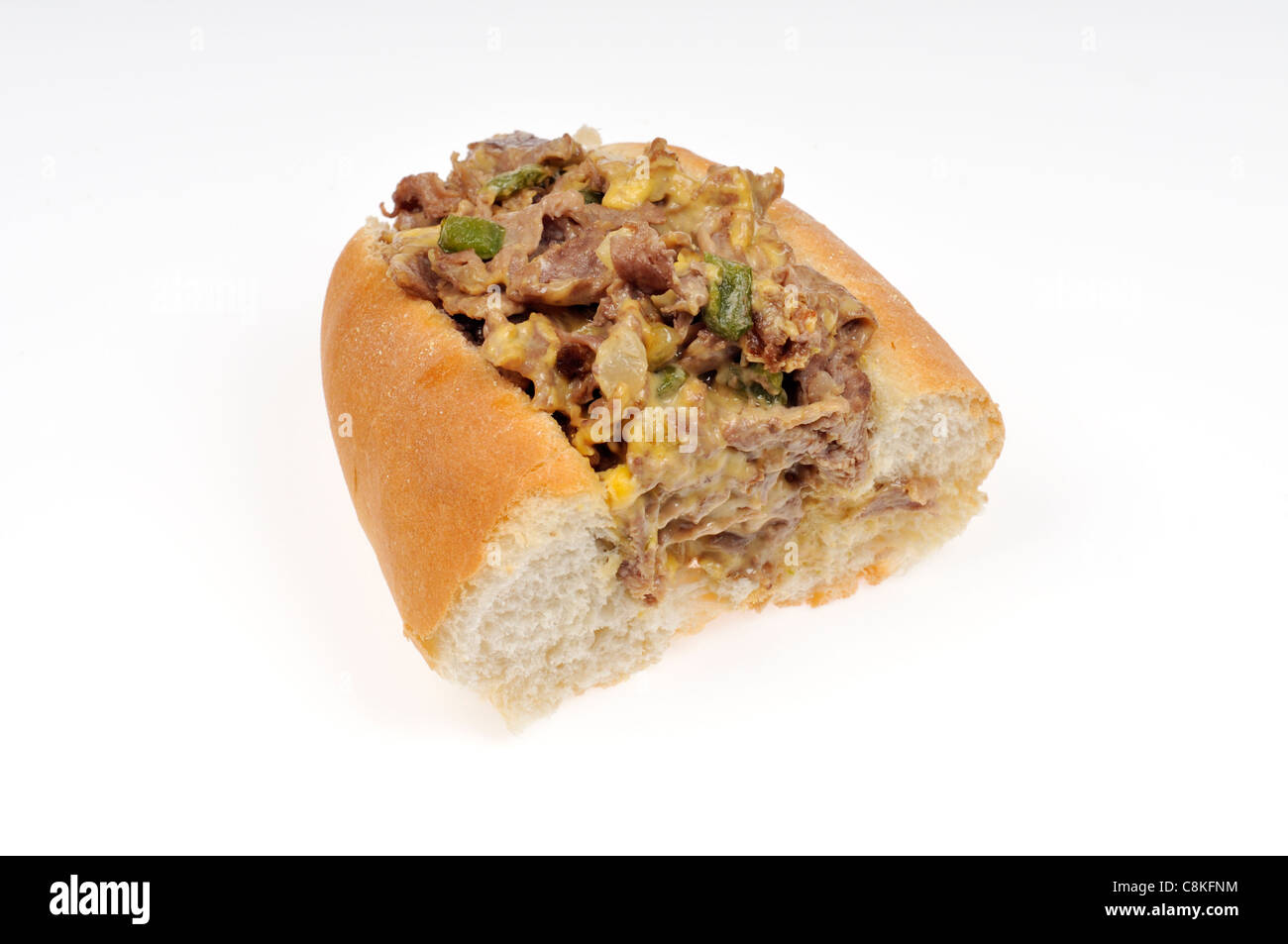 Half of a Philadelphia cheesesteak submarine sandwich on white ...