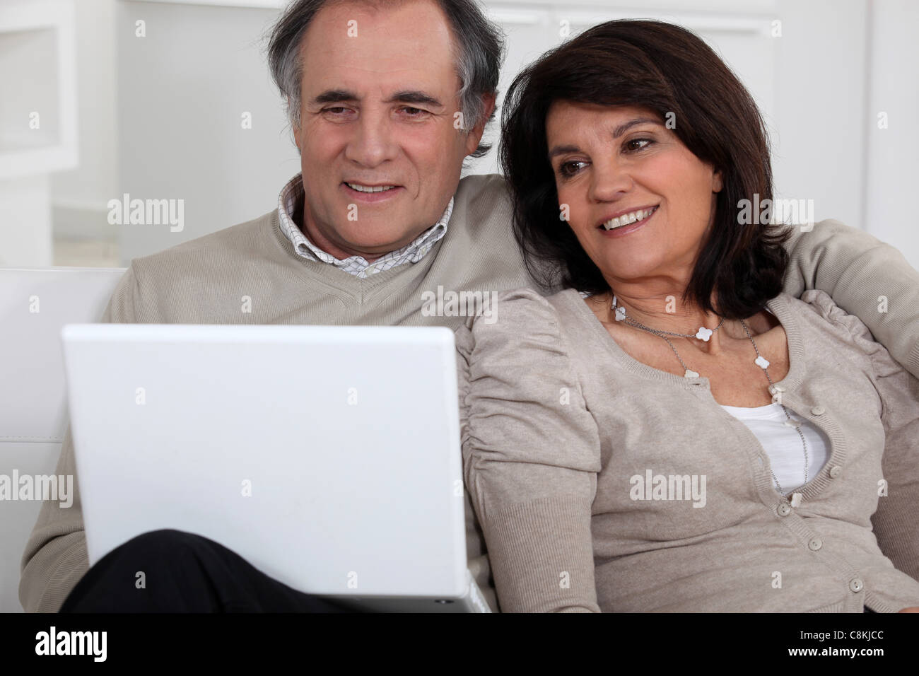 Middle aged husband wife surfing internet hi-res stock photography and ...