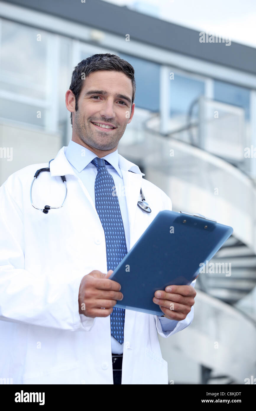 Doctor with clip-board Stock Photo - Alamy