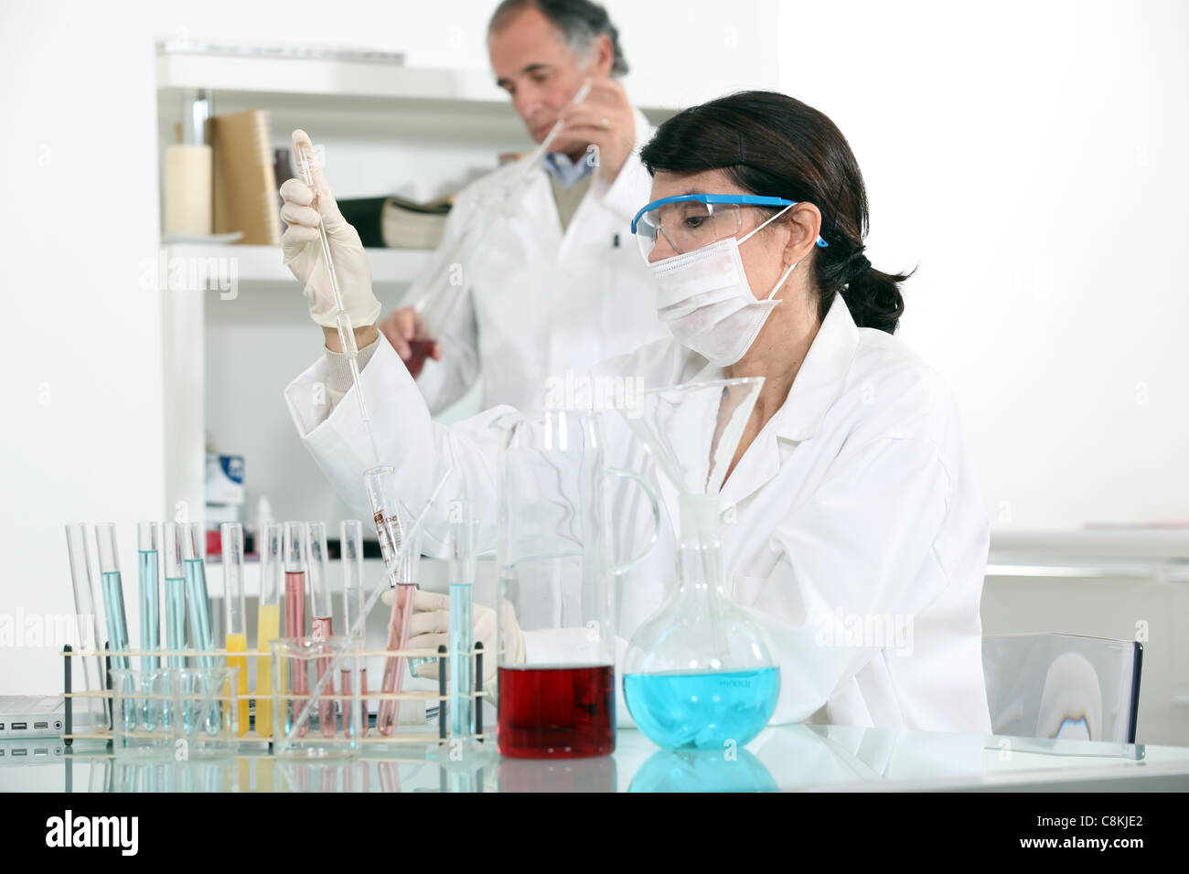 Scientists performing experiments Stock Photo - Alamy