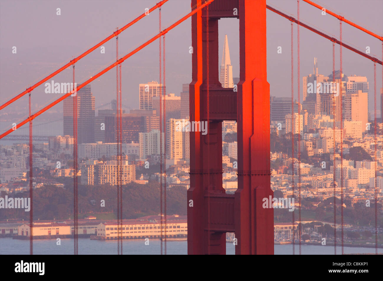 Sunset view of Golden Gate Bridge with city of San Francisco on the ...