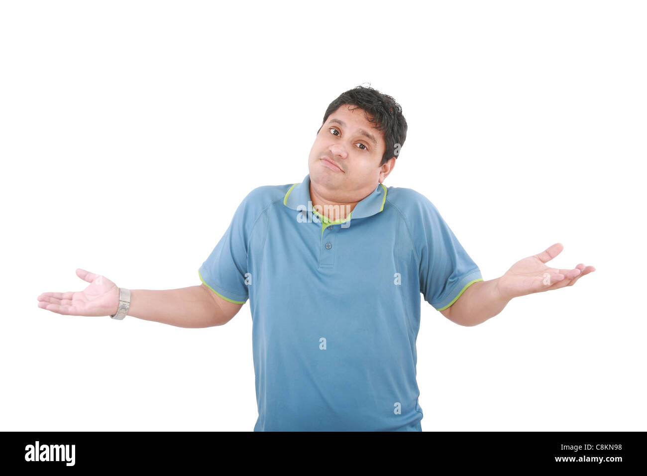 Portrait of man gesturing do not know sign against white background ...