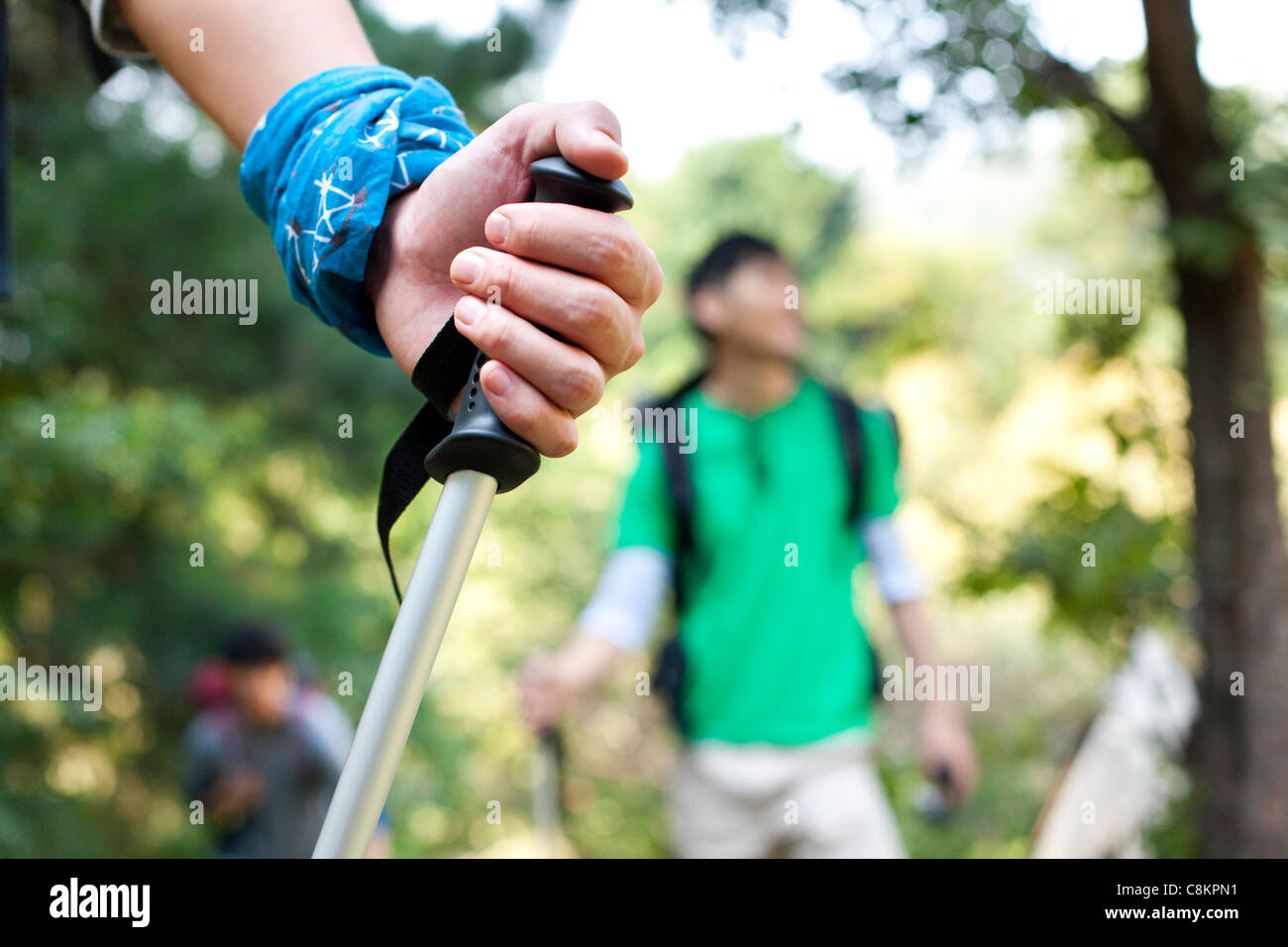 Young people go hiking in mountain Stock Photo - Alamy