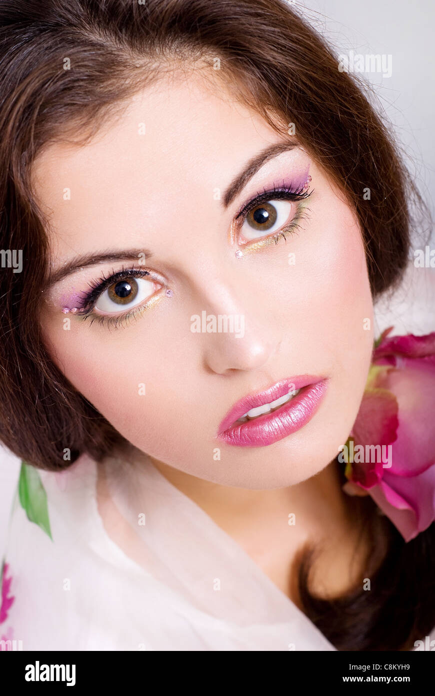 Beautiful young woman face isolated on white background Stock Photo - Alamy