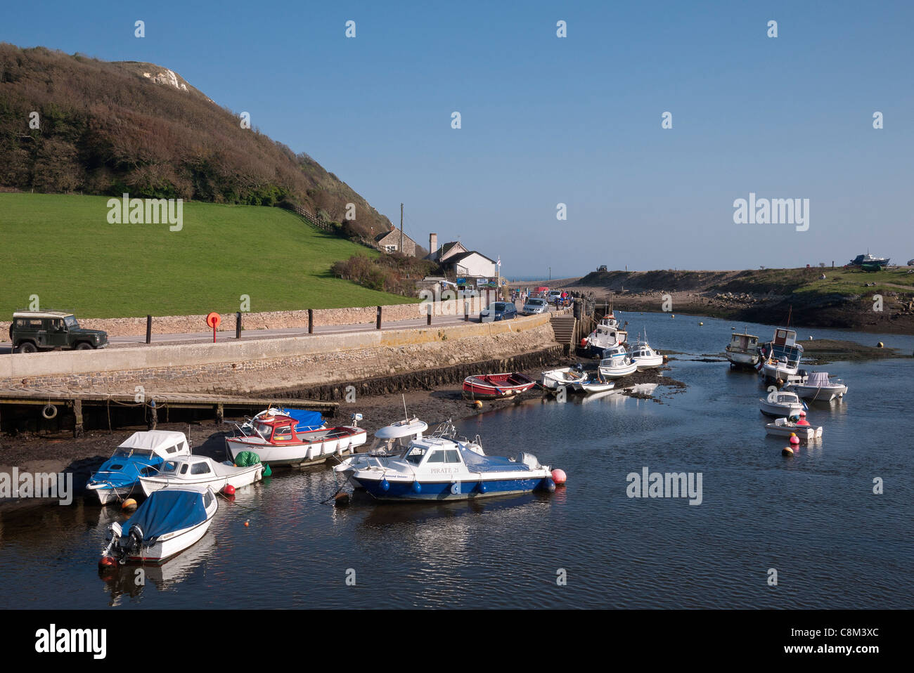 Seaton Harbour with boats moored, River Axe estuary, Devon, England, UK ...