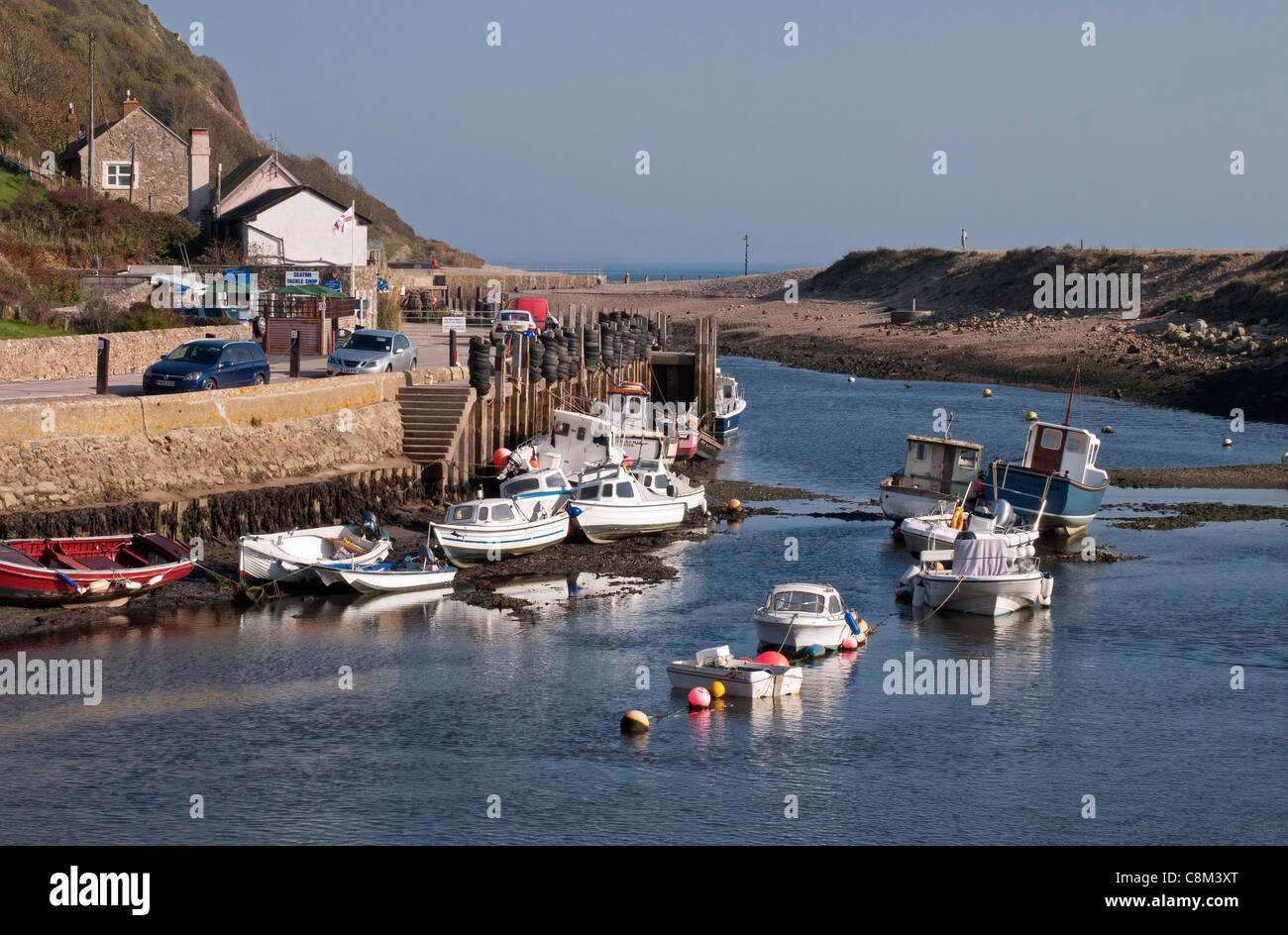 Seaton Harbour with boats moored, River Axe estuary, Devon, England, UK ...