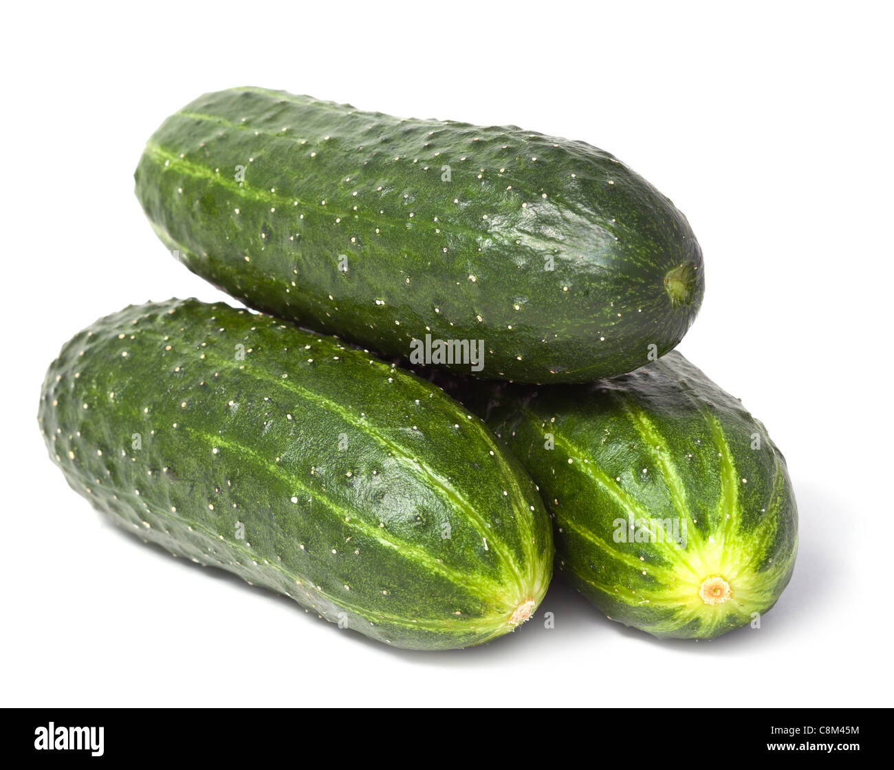 Pile of three cucumbers on white background with shadow Stock Photo - Alamy