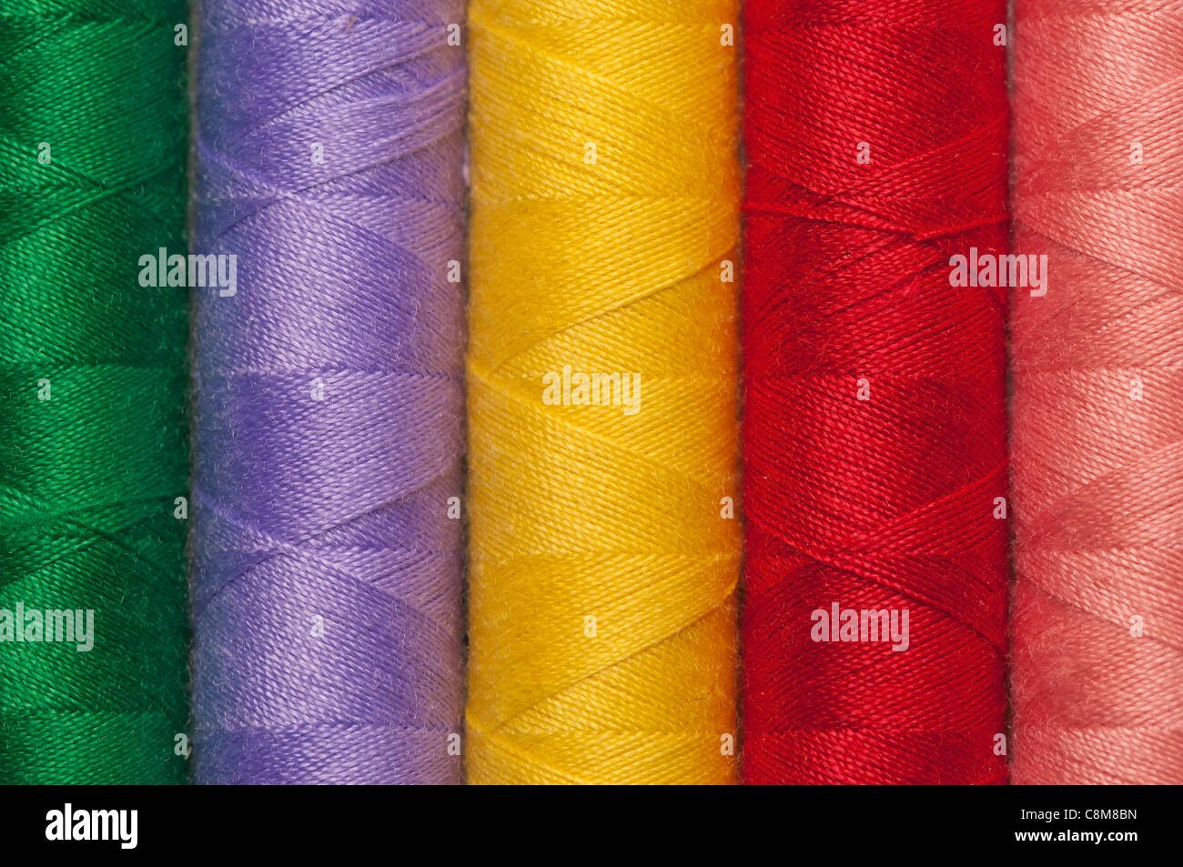 A rainbow of different colour cotton reels Stock Photo - Alamy