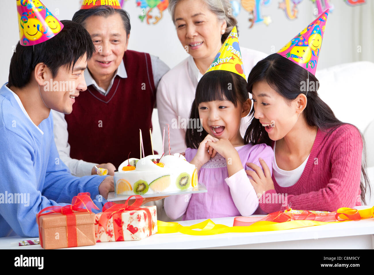 Young Chinese girl's birthday with family Stock Photo - Alamy