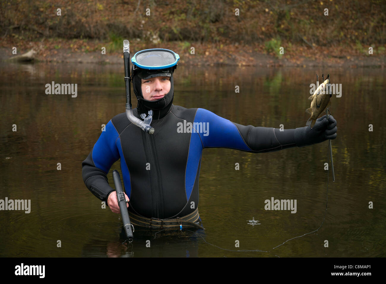 Hunter has killed very small fish, it is forbidden Stock Photo - Alamy