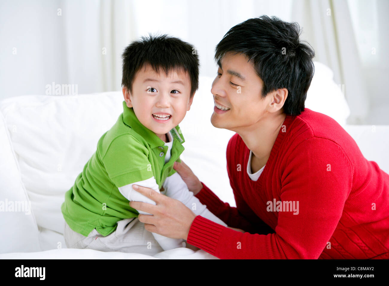 Happy Chinese father with son Stock Photo - Alamy