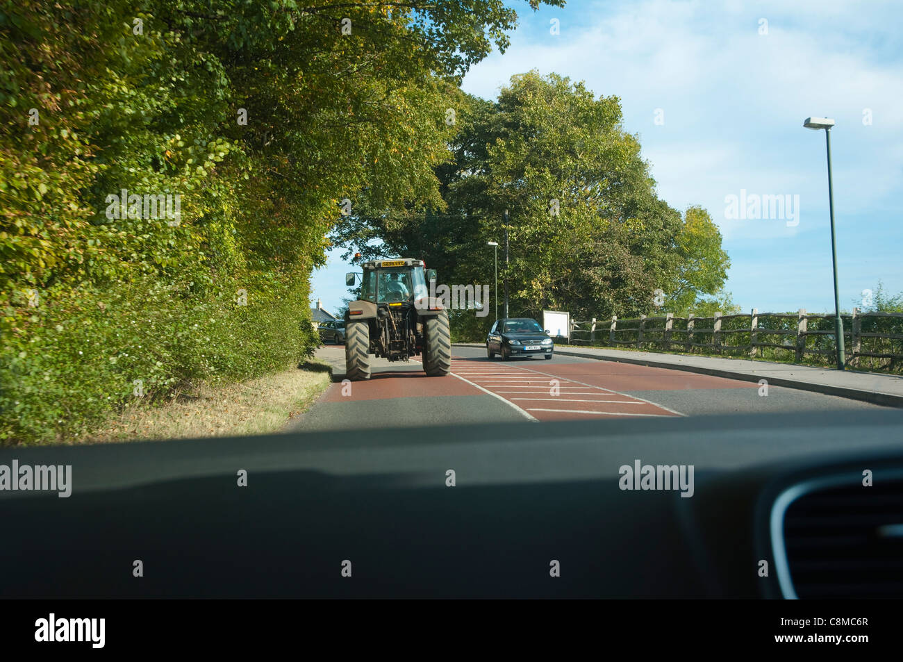 Stuck behind a tractor whilst driving, with a car approaching on the ...