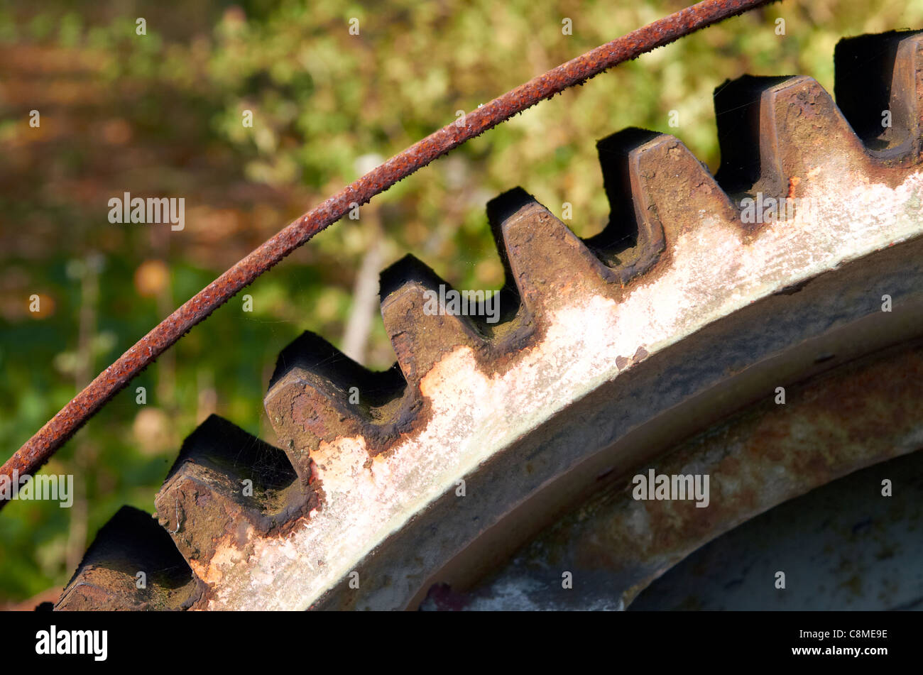 Rusty iron and steel cog or gear wheels on old industrial machinery ...