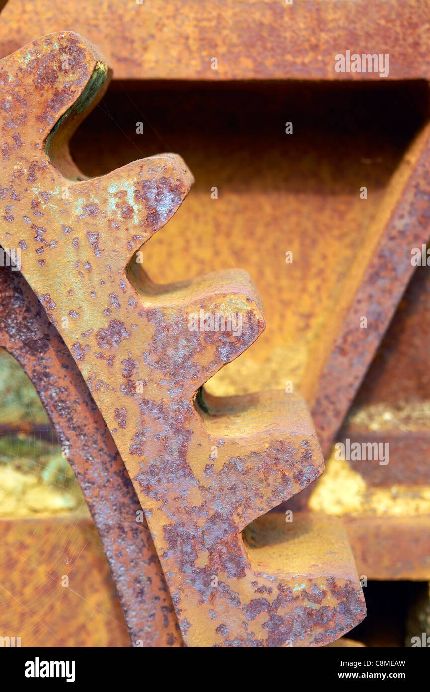 Rusty iron and steel cog or gear wheels on old industrial machinery ...