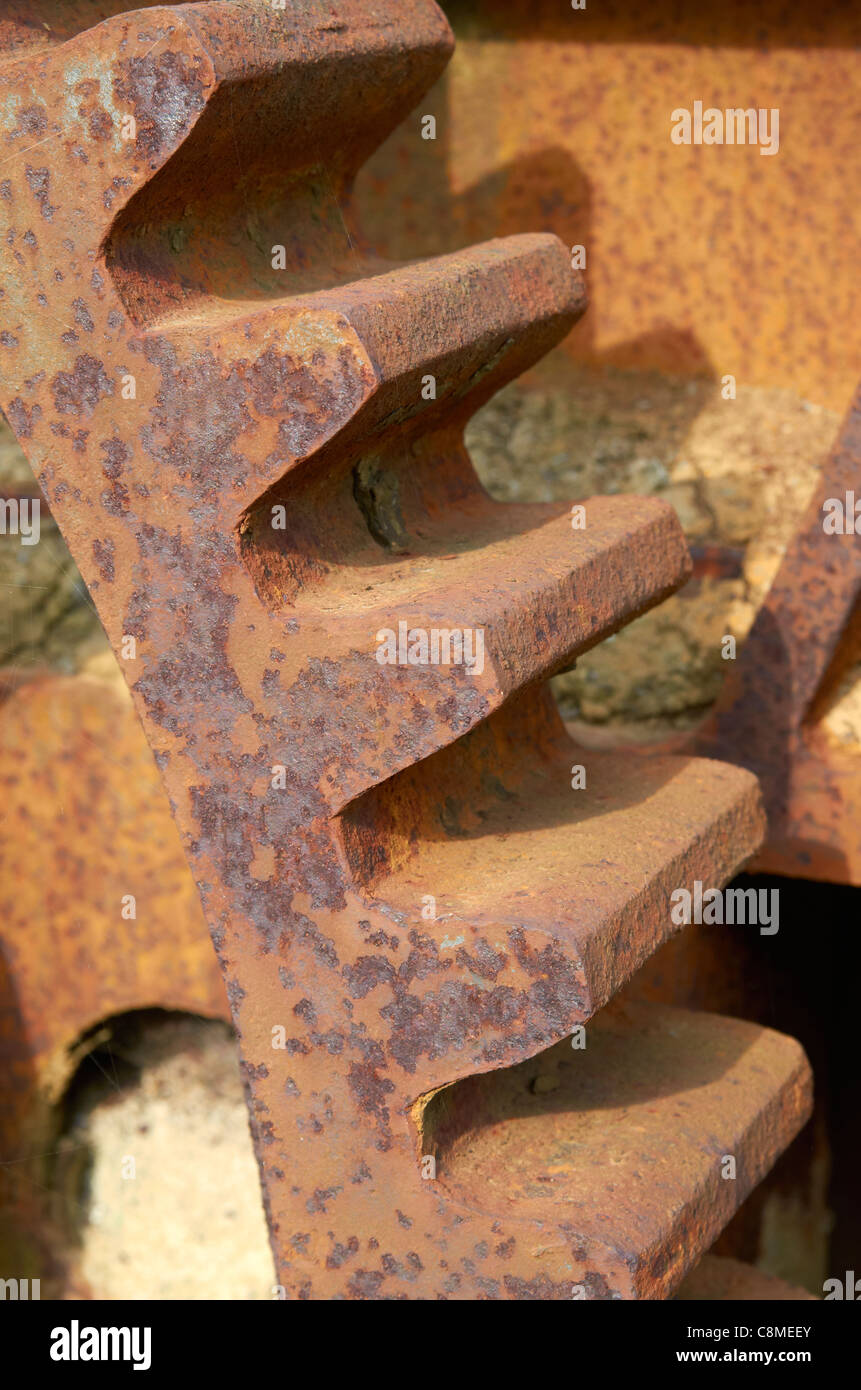 Rusty iron and steel cog or gear wheels on old industrial machinery ...