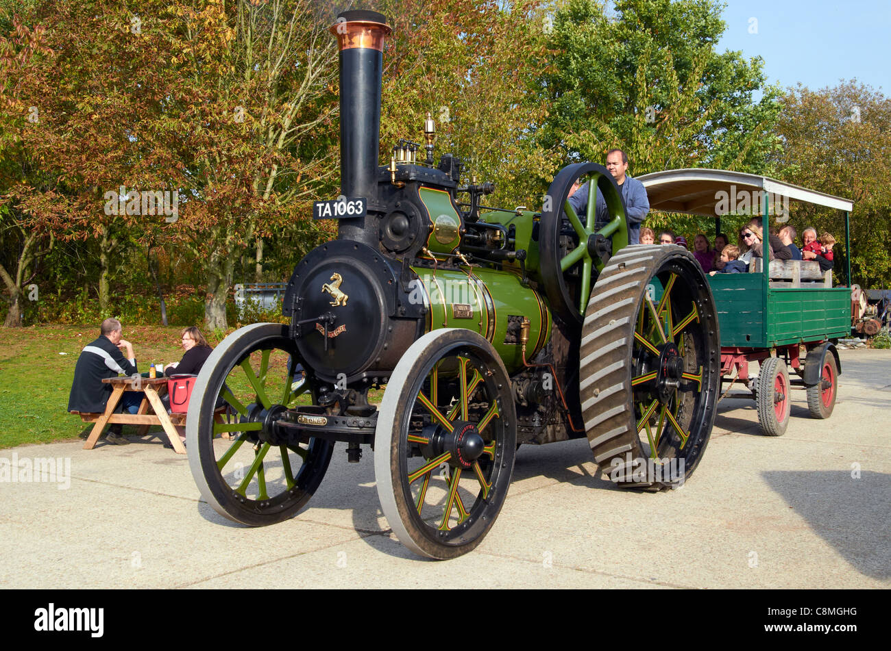 Steam traction engine hauling a trailer giving rides around an ...