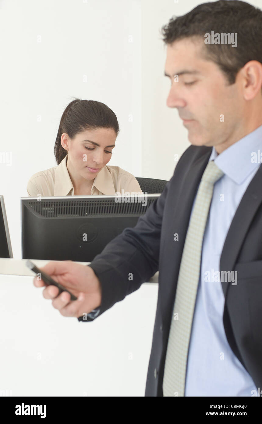 Hispanic business people working in office Stock Photo - Alamy