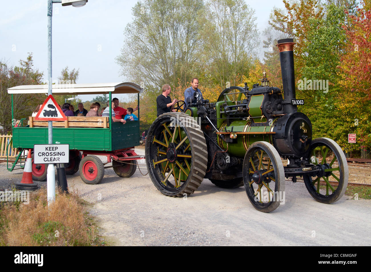 Steam traction engine hauling a trailer giving rides around an ...