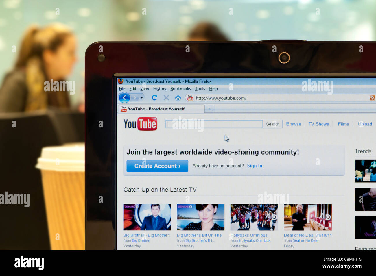 The YouTube website shot in a coffee shop environment (Editorial use ...