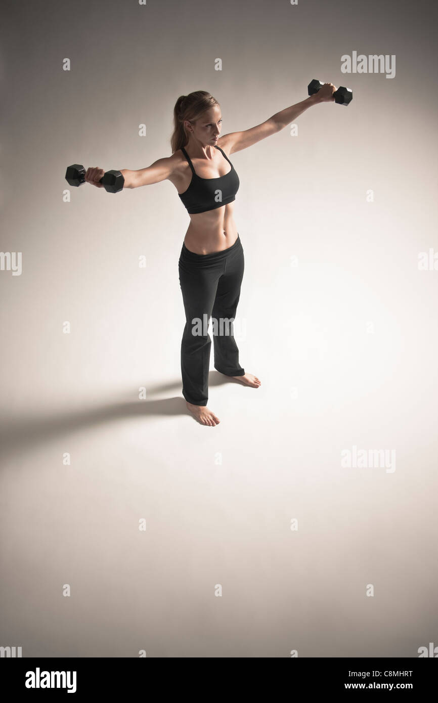 Woman exercising raises arms hi-res stock photography and images - Alamy