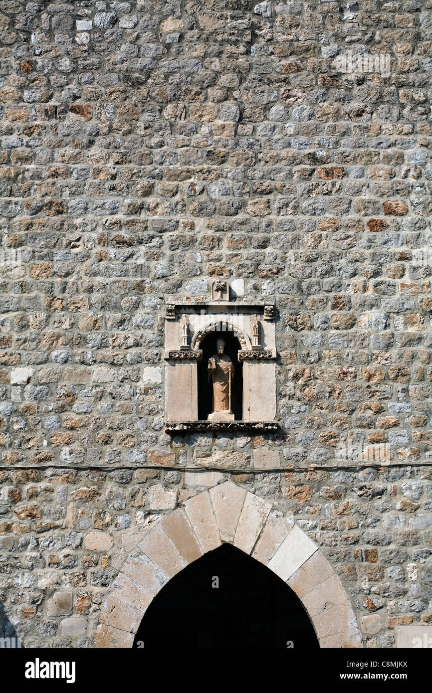 Medieval Religious figurine Sculpture placed in a niche in the city ...