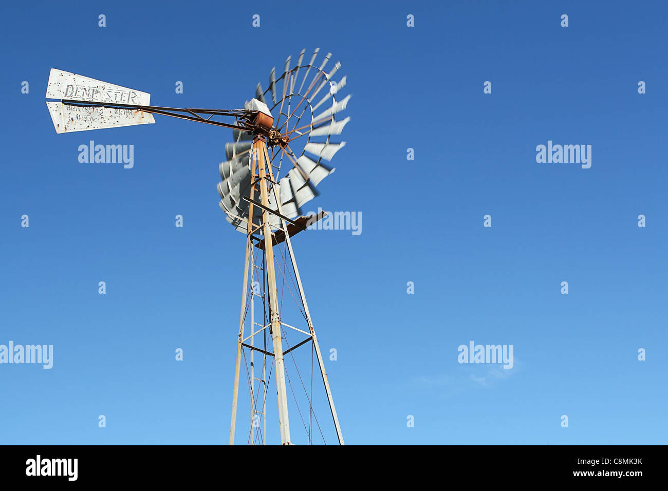 An agriculture windmill against a blue sky Stock Photo - Alamy