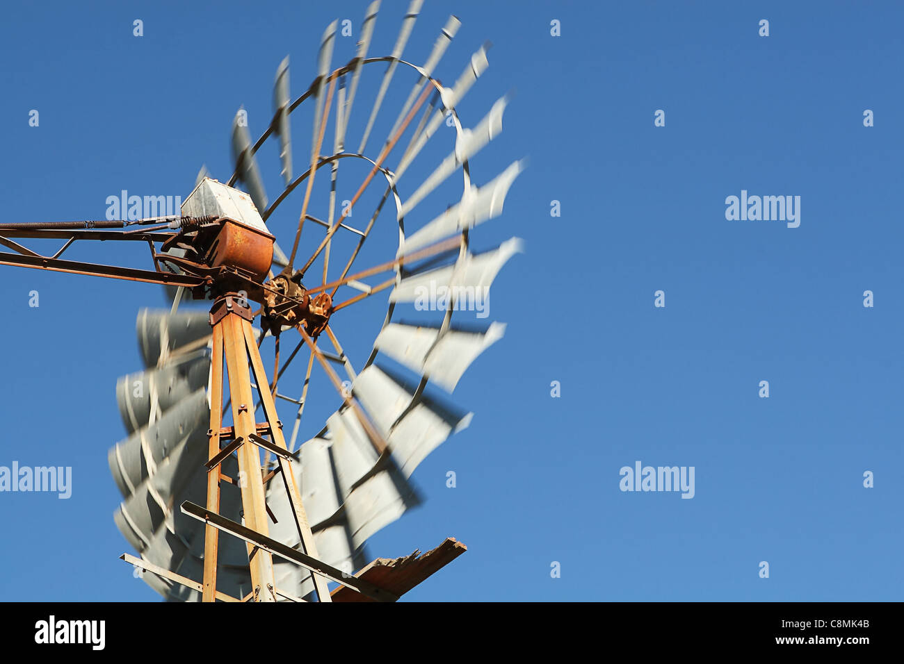 An agriculture windmill against a blue sky Stock Photo - Alamy