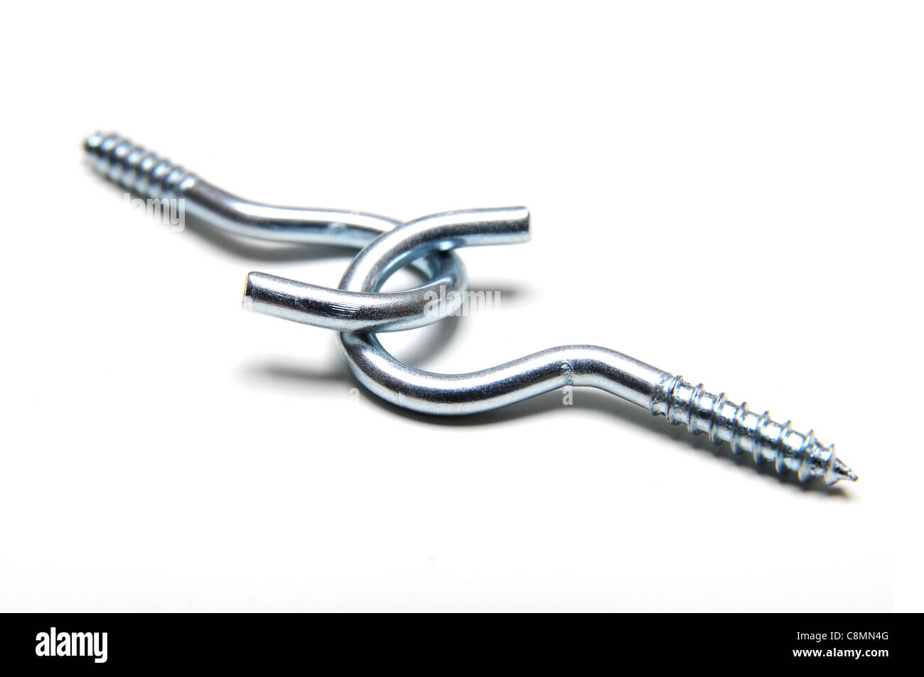 Two connected threaded hooks on white background Stock Photo - Alamy
