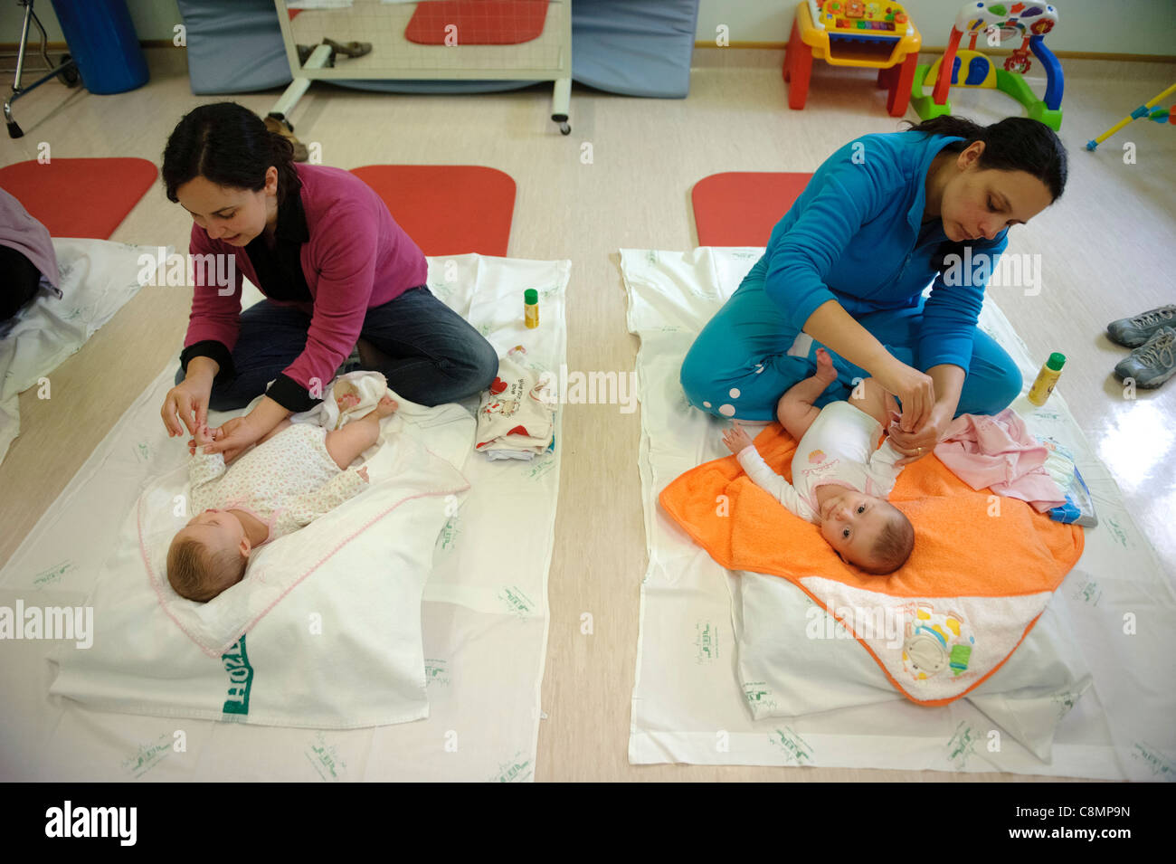 Women taking care of babies Stock Photo - Alamy