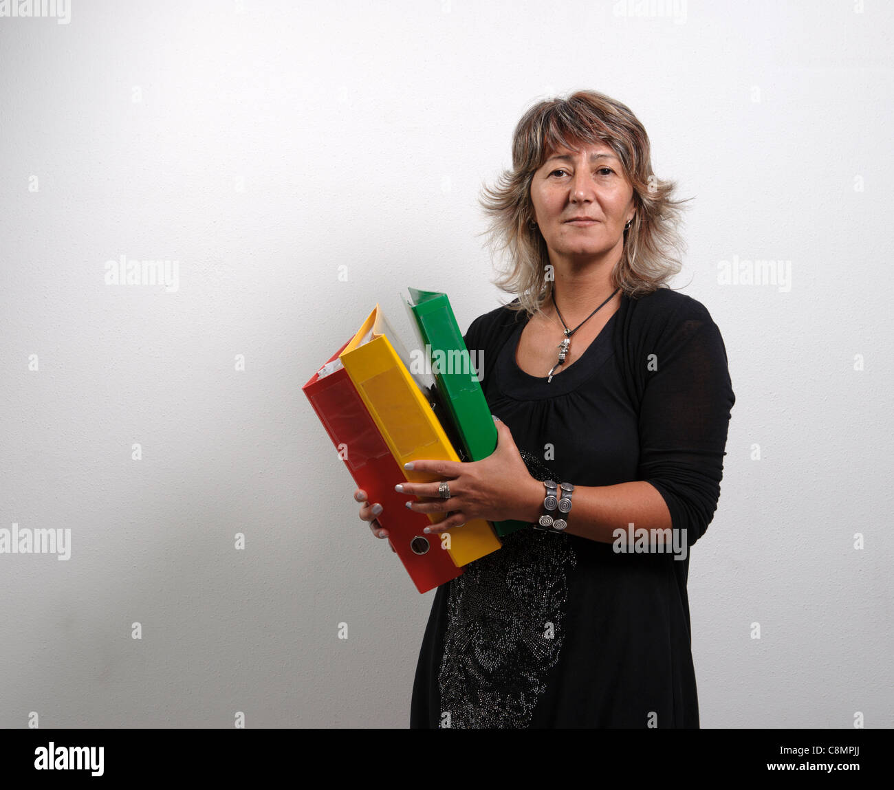 Female office holding file folders hi-res stock photography and images ...