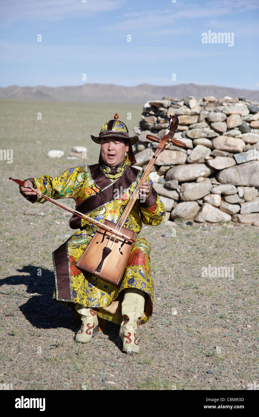 Musician playing the Morin khuur, the typical musical instrument of ...