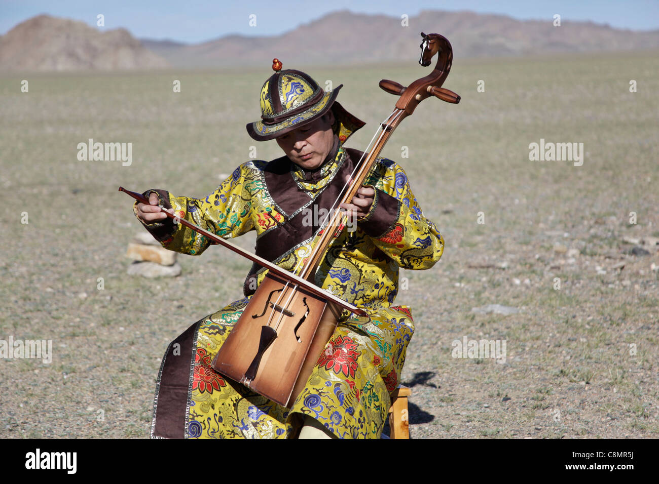 Musician playing the Morin khuur, the typical musical instrument of ...