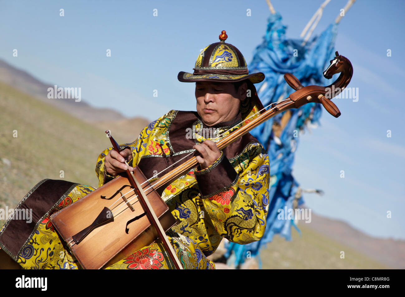 Musician playing the Morin khuur, the typical musical instrument of ...