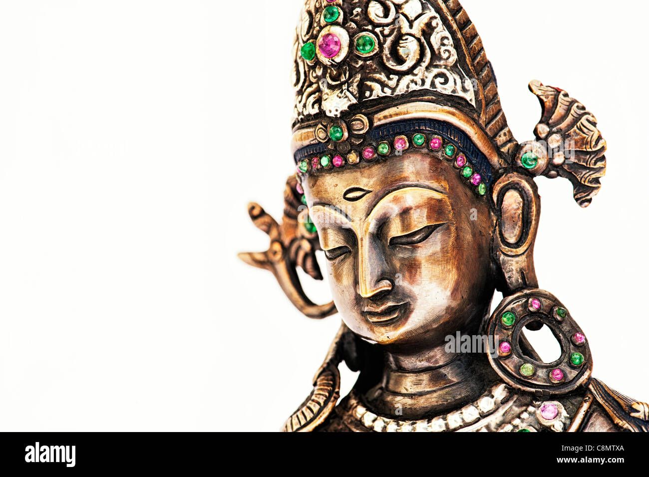 Sitting Indian deity statue on white background Stock Photo - Alamy