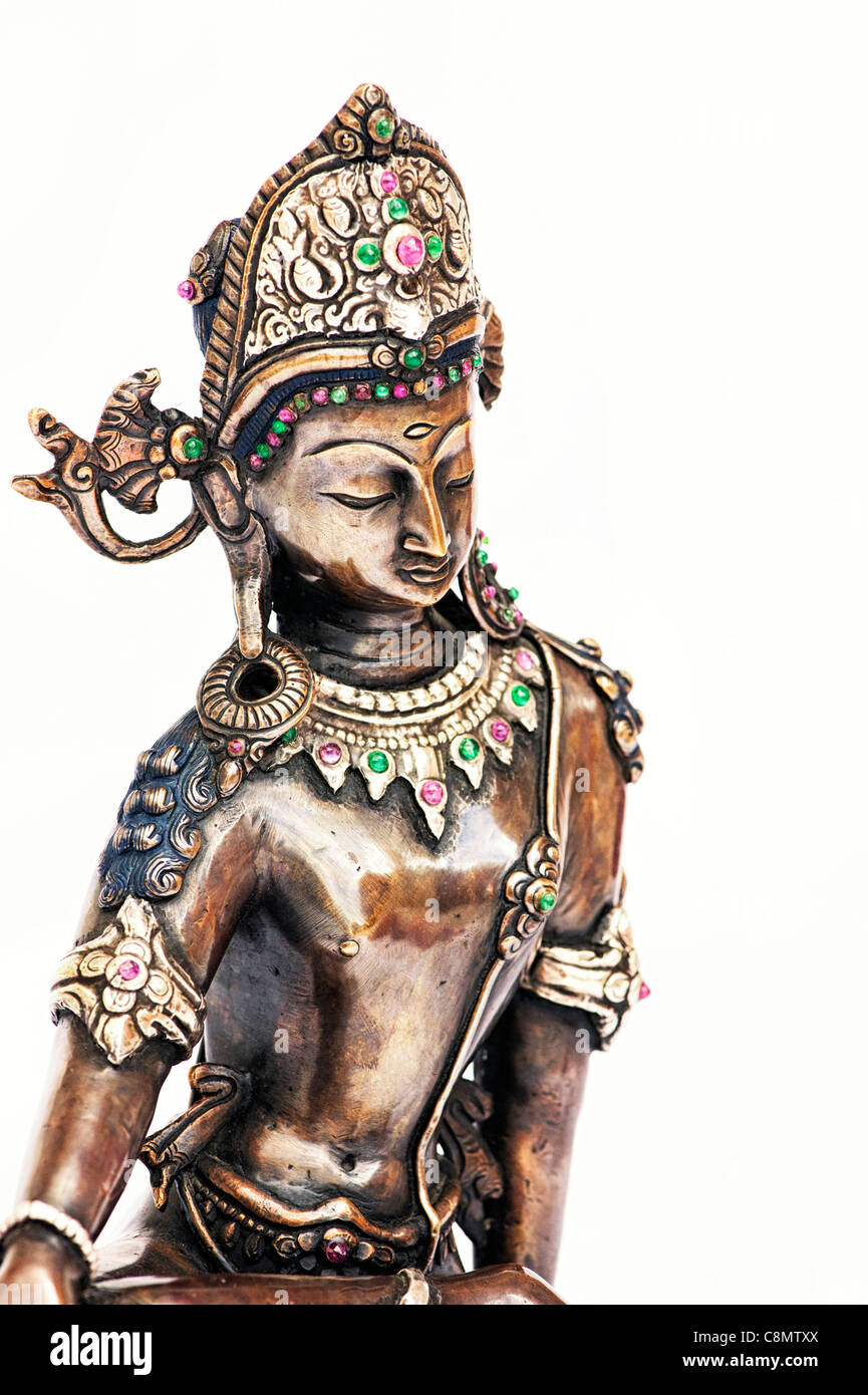 Sitting Indian deity statue on white background Stock Photo - Alamy