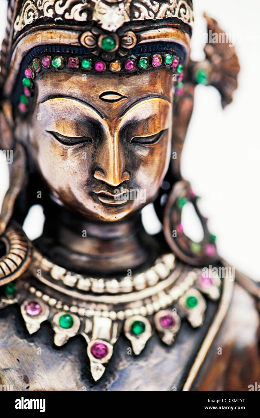 Sitting Indian deity statue on white background Stock Photo - Alamy