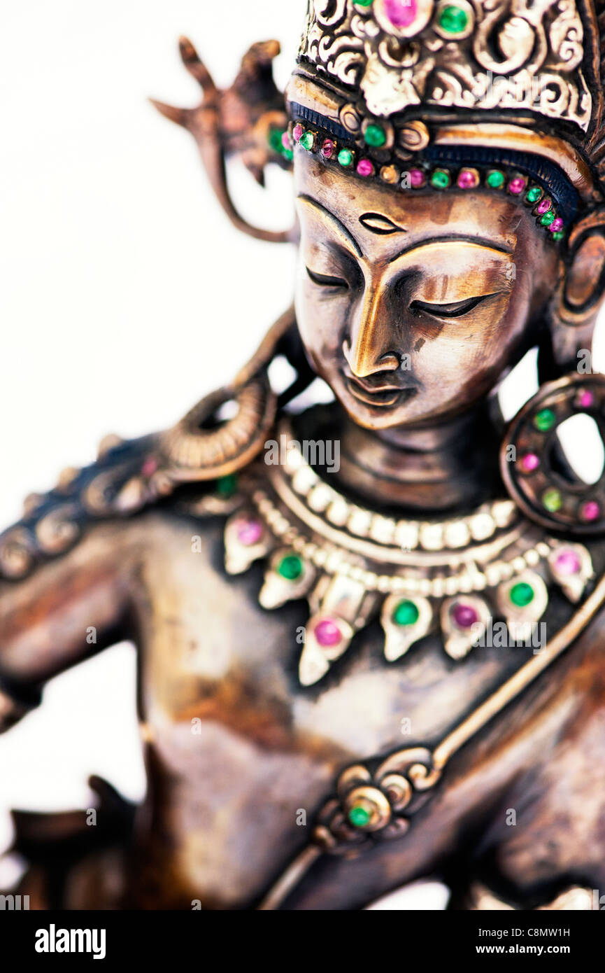 Sitting Indian deity statue on white background Stock Photo - Alamy